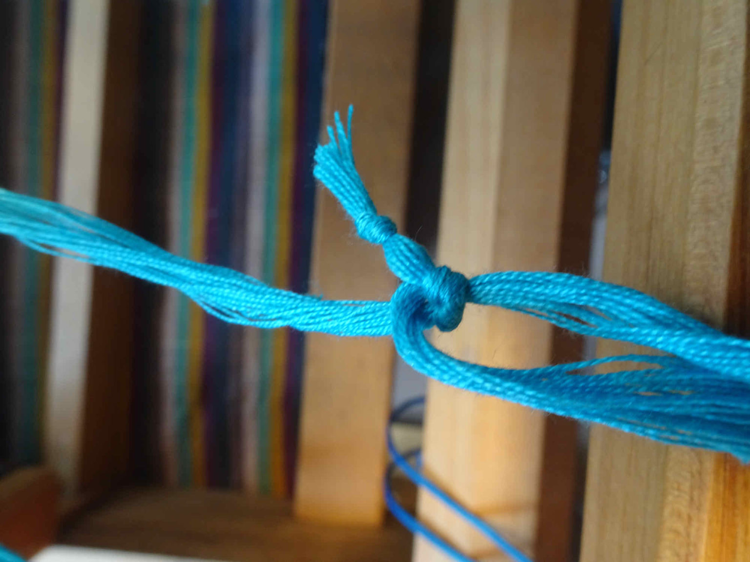 Project 10 – Tying the warp onto the back apron rod – Weaving from Paradise